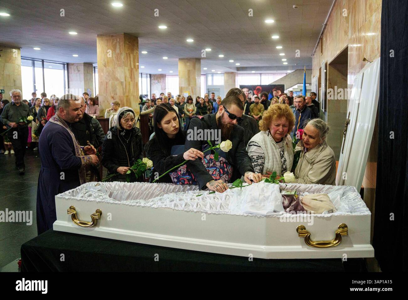 Relatives say goodbye to Olena Kohut, an orchestra musician who was ...