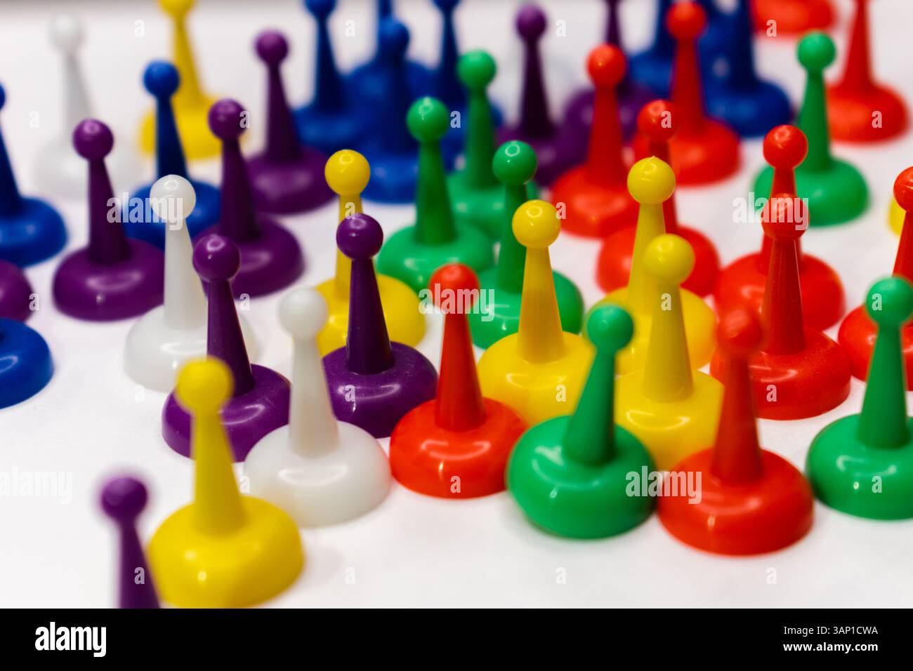Colourful pawns isolated on white background Stock Photo - Alamy