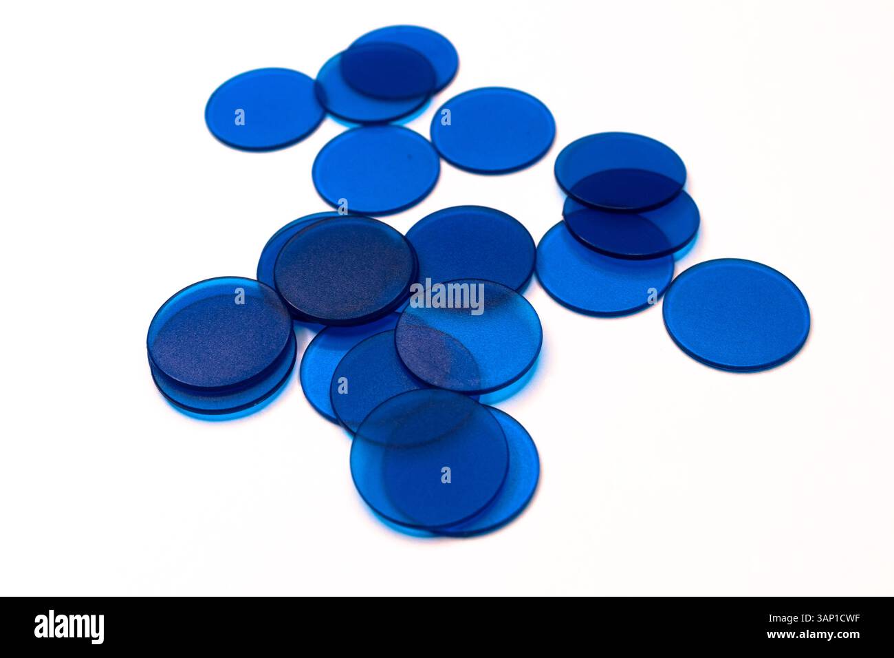 Blue bingo chips isolated on white background Stock Photo - Alamy
