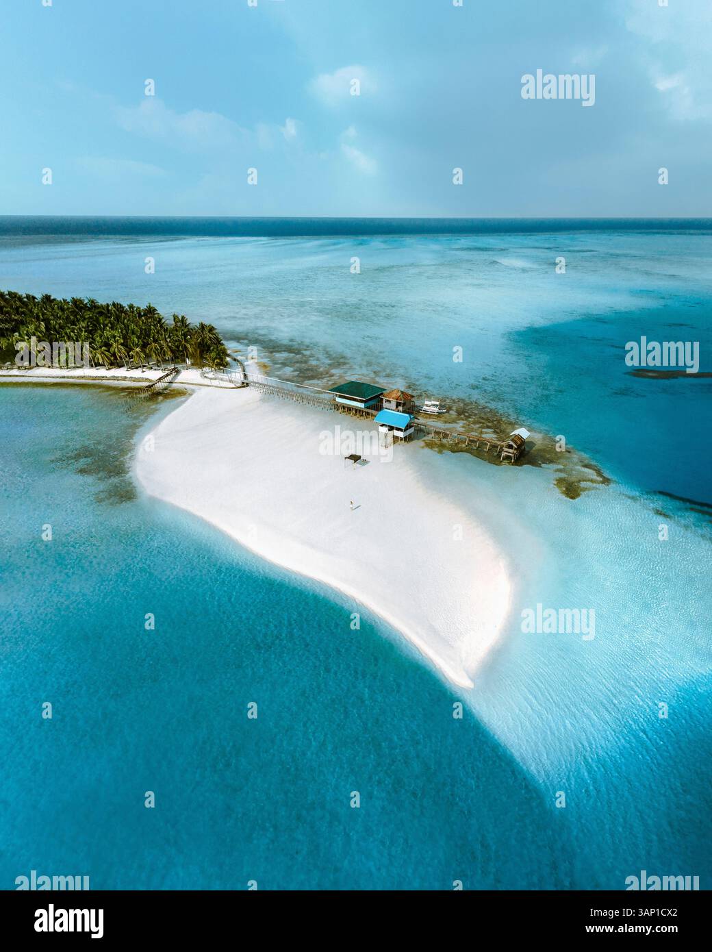 Aerial view of remote tropical island with blue ocean and sandy beach ...