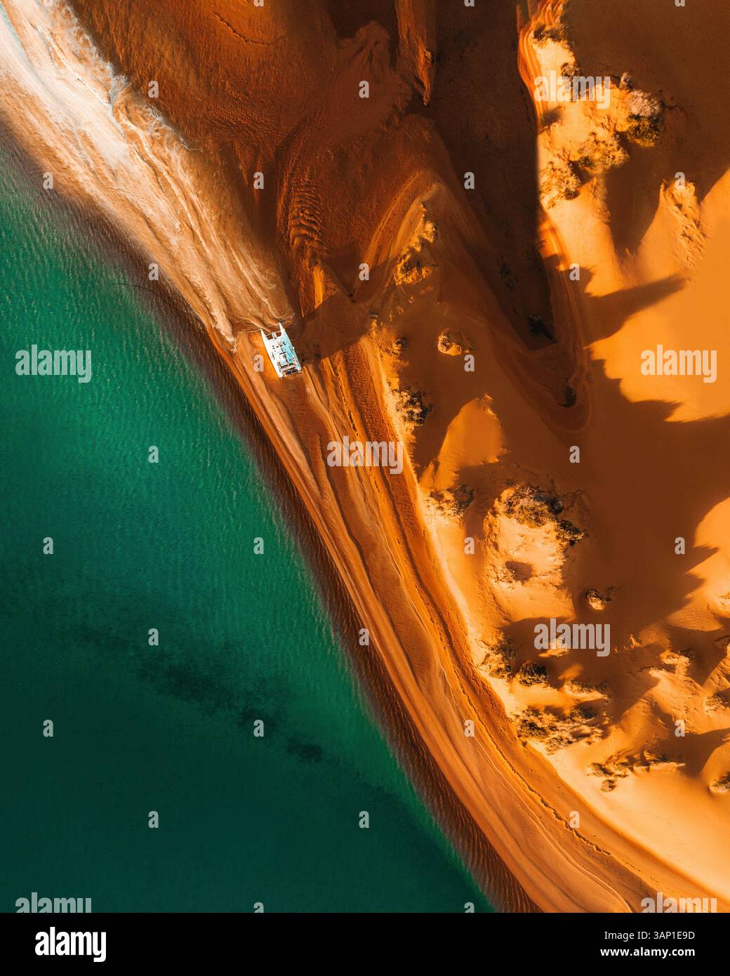 Aerial view of a catamaran beached on the sandbanks at Big Lagoon ...