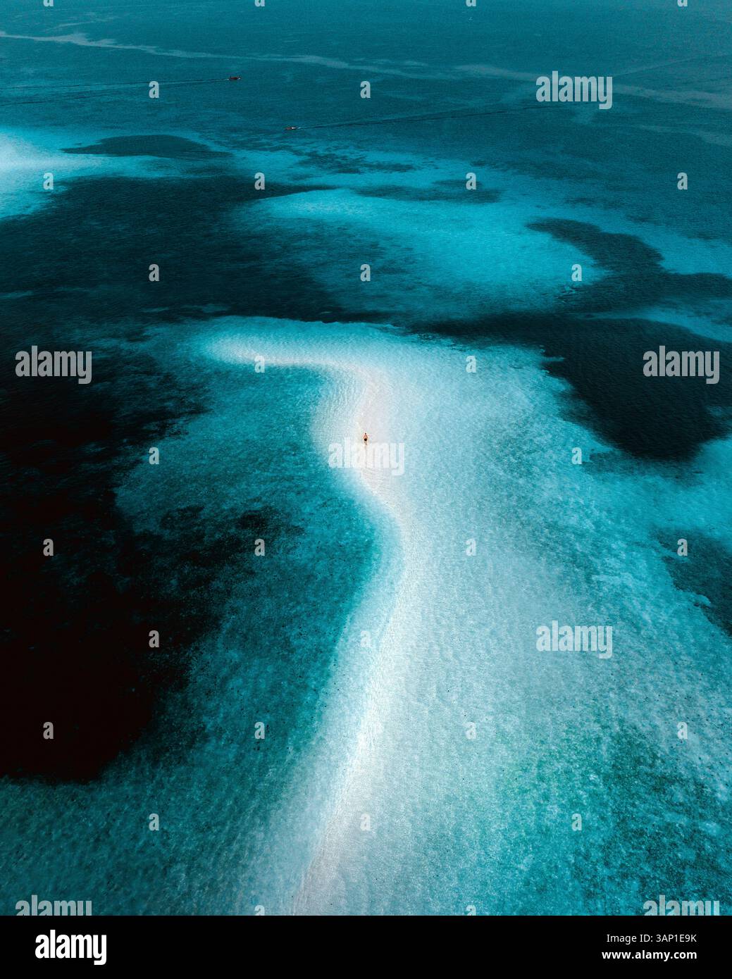 Aerial view of a person walking on the sandbar at Balabac, James ...