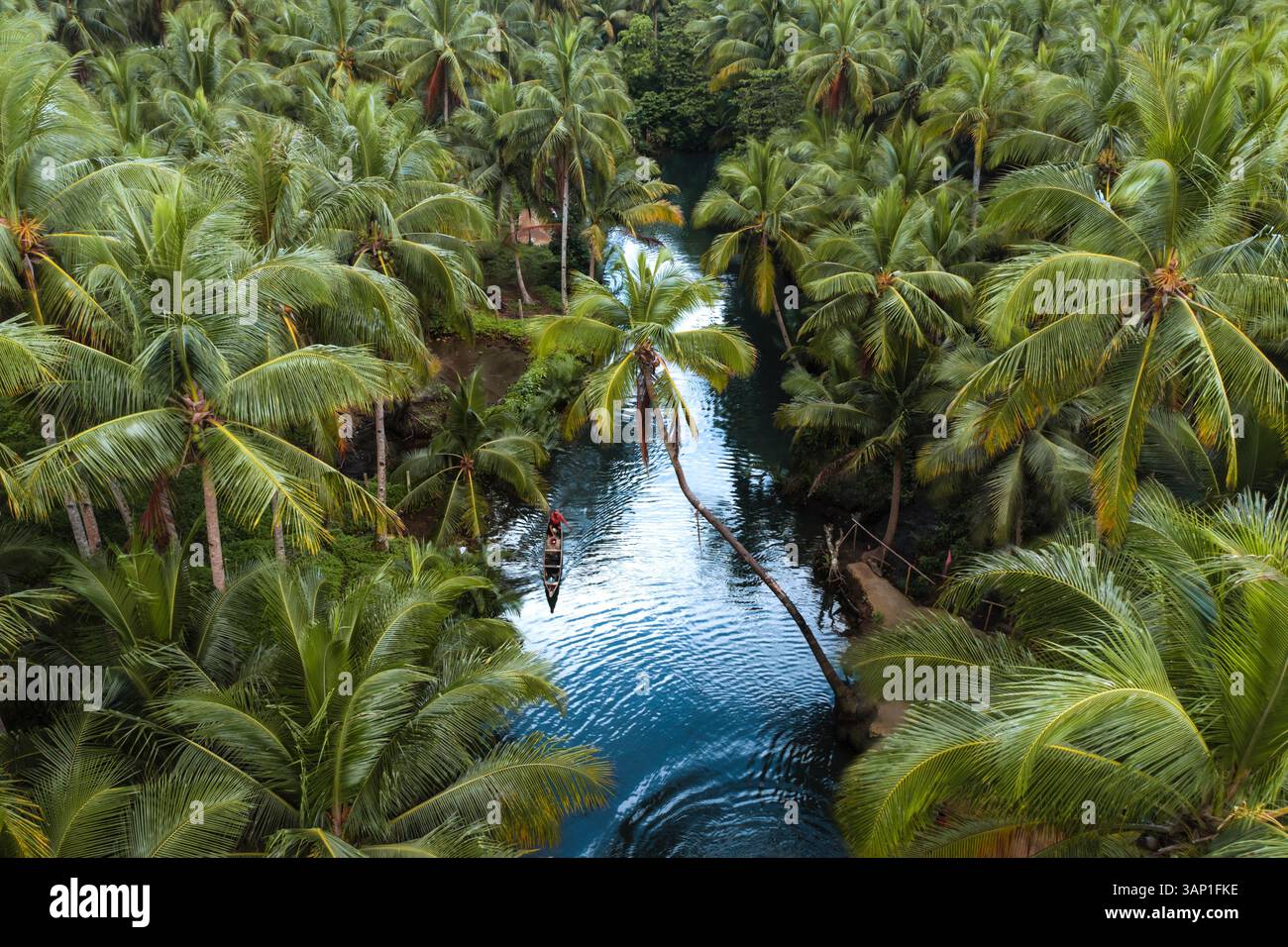 Aerial view of people on a canoe sailing along the Maasin River ...