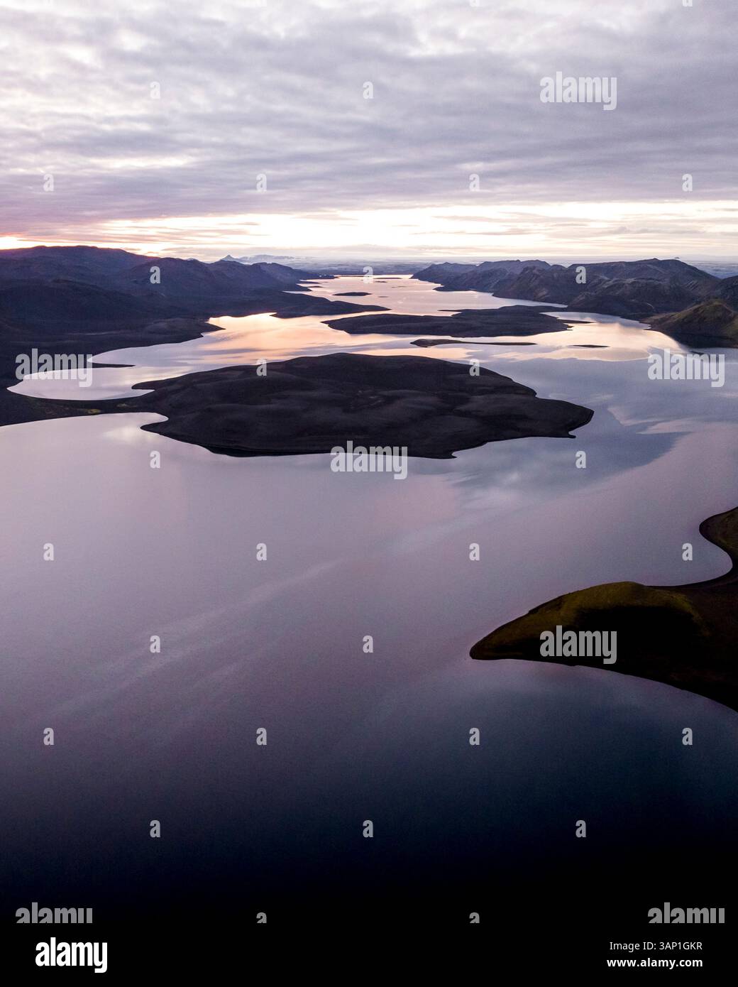 Aerial view of Langisfor lake at sunset, a scenic lake surrounded by ...