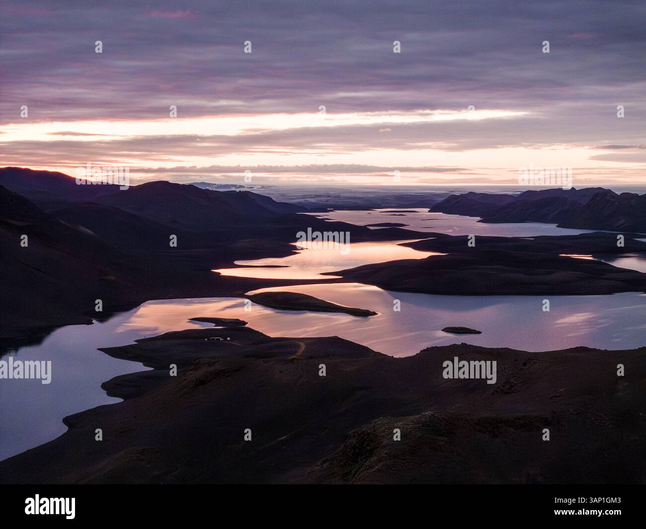 Aerial view of Langisfor lake at sunset, a scenic lake surrounded by ...