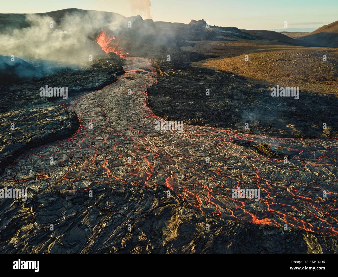 Aerial view of a volcano smoking from the crater, view of magma ...