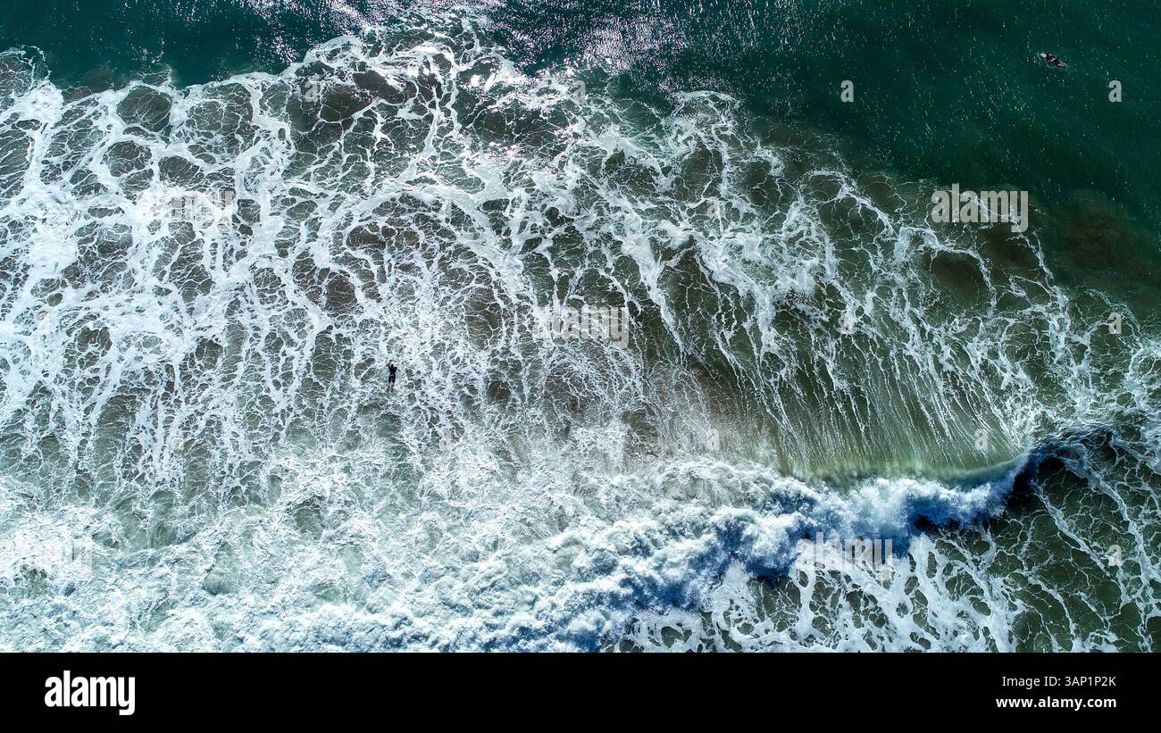 Aerial view of top down shot of wave at Farnborugh Beach, Yeppoon ...