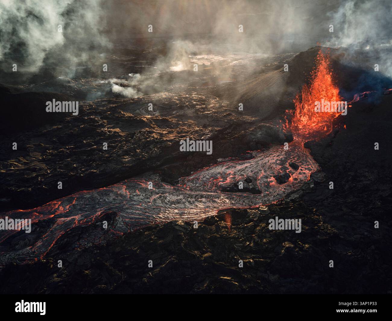 Aerial view of a volcano smoking from the crater, view of magma ...