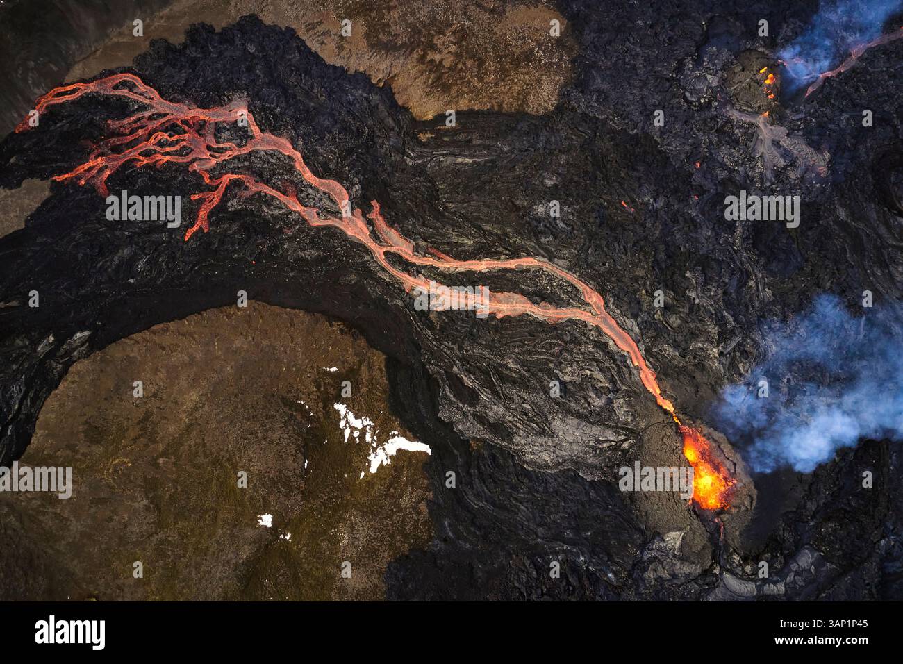 Aerial view of a volcano smoking from the crater, view of magma erupting from the crater with ...