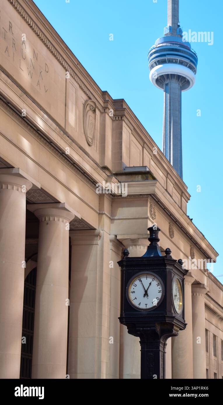 Clock tower at Union Station and CN Tower in Toronto Ontario Canada on ...
