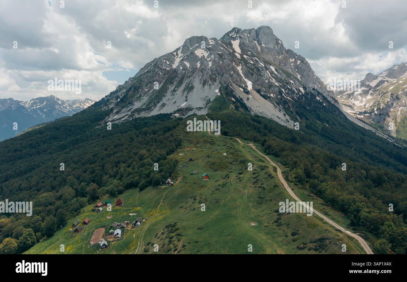 Aerial view of majestic mountain landscape with serene village and ...