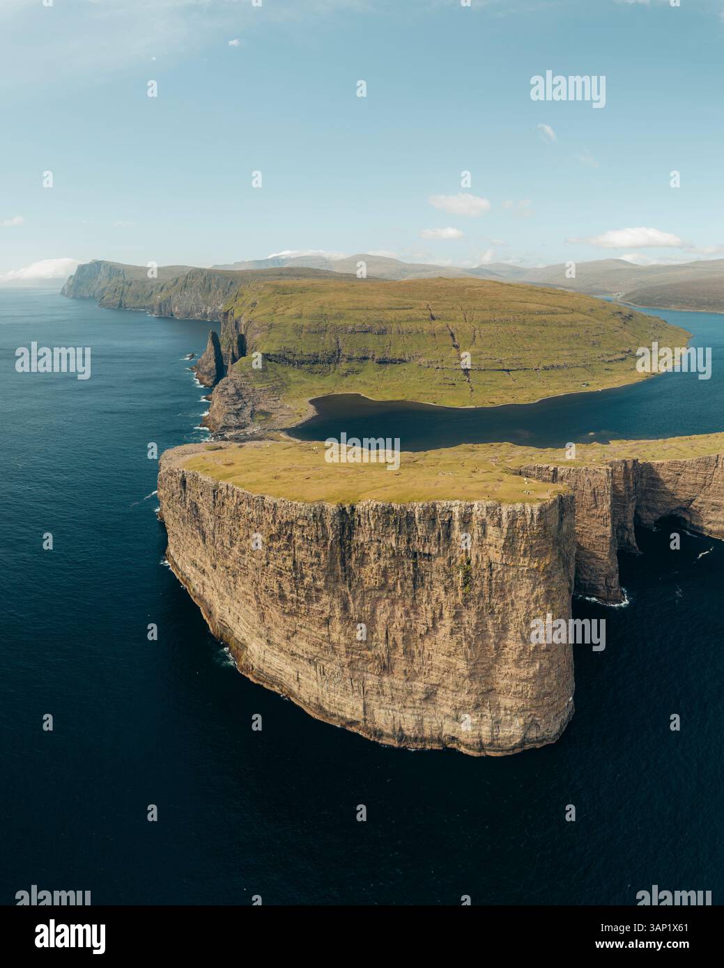Aerial view of rugged cliffs and tranquil ocean along the picturesque ...