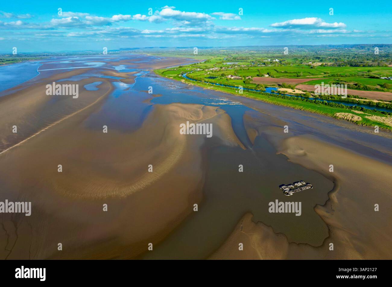 Aerial view of shipwrecks along the River Severn with scenic mudflats ...