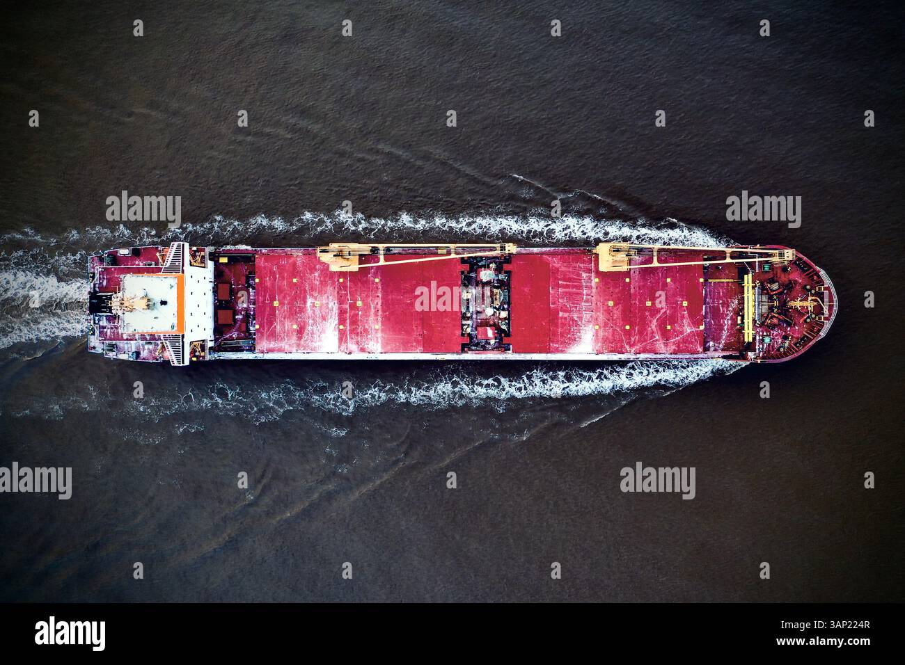Aerial view of Bulk carrying vessel with cranes top down view River ...