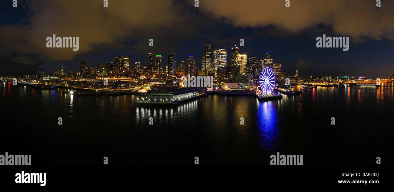 Aerial view of illuminated cityscape featuring the Seattle Big Wheel ...