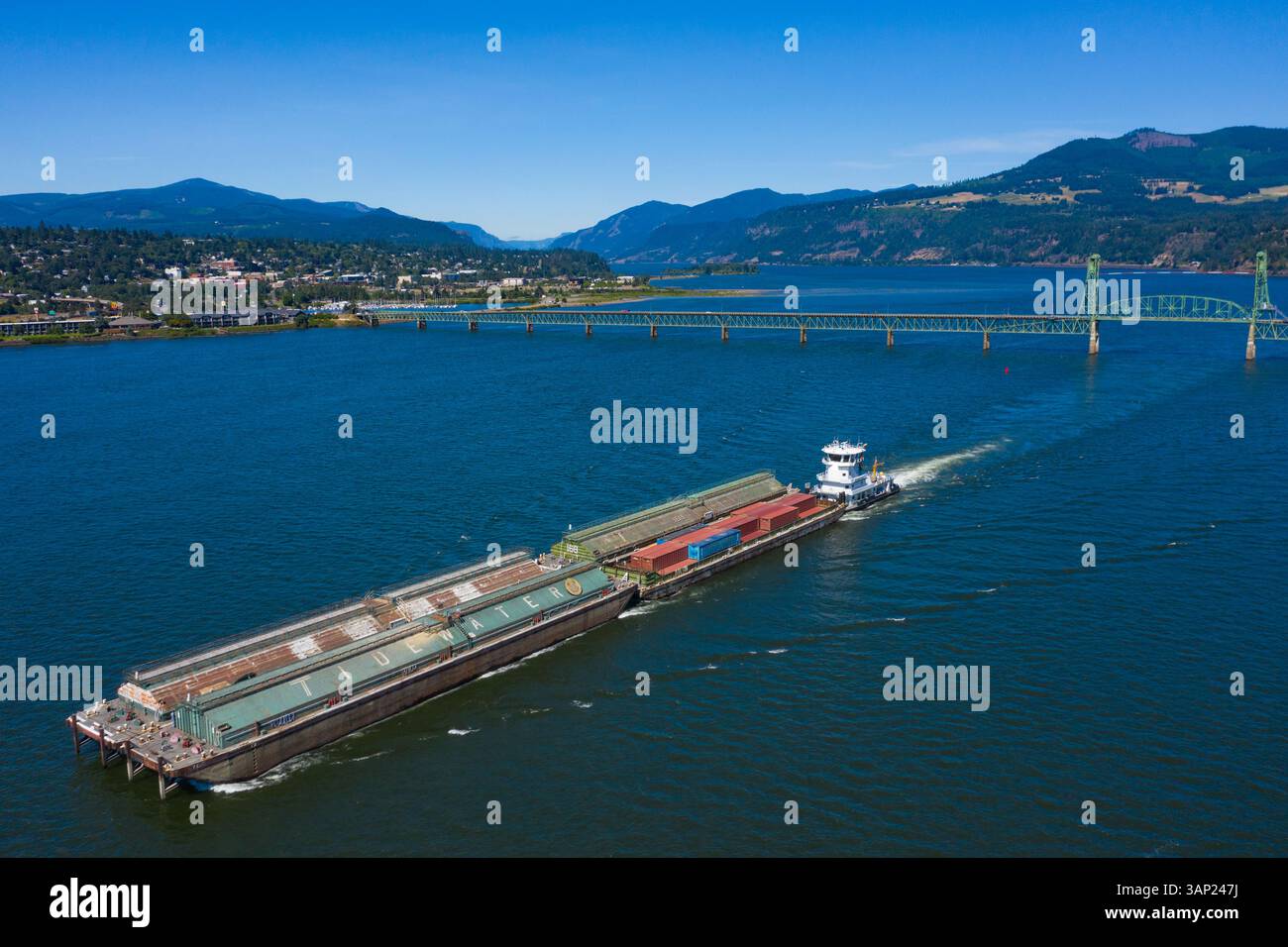 Aerial view of hood river bridge and river barge on columbia river with ...