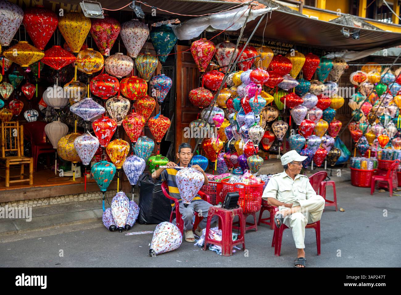 Lantern Making in Hoi An, Vietnam A man makes a lantern outside his ...