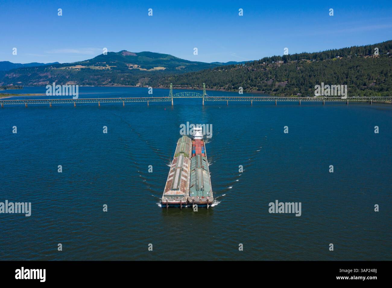 Aerial view of the majestic Hood River Bridge and river barge on the ...