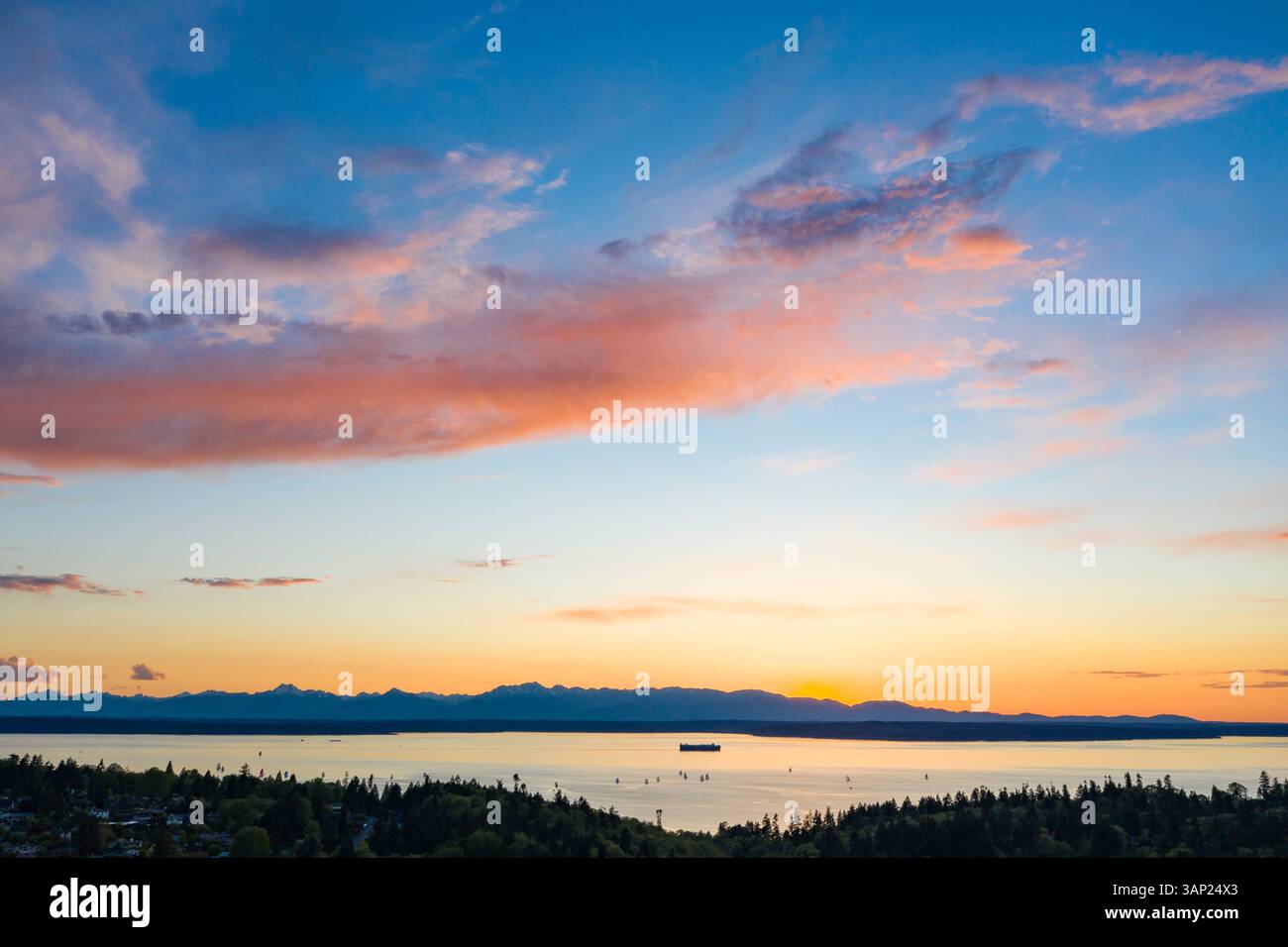 Aerial view of serene twilight over Salish Sea with sailboats and ...