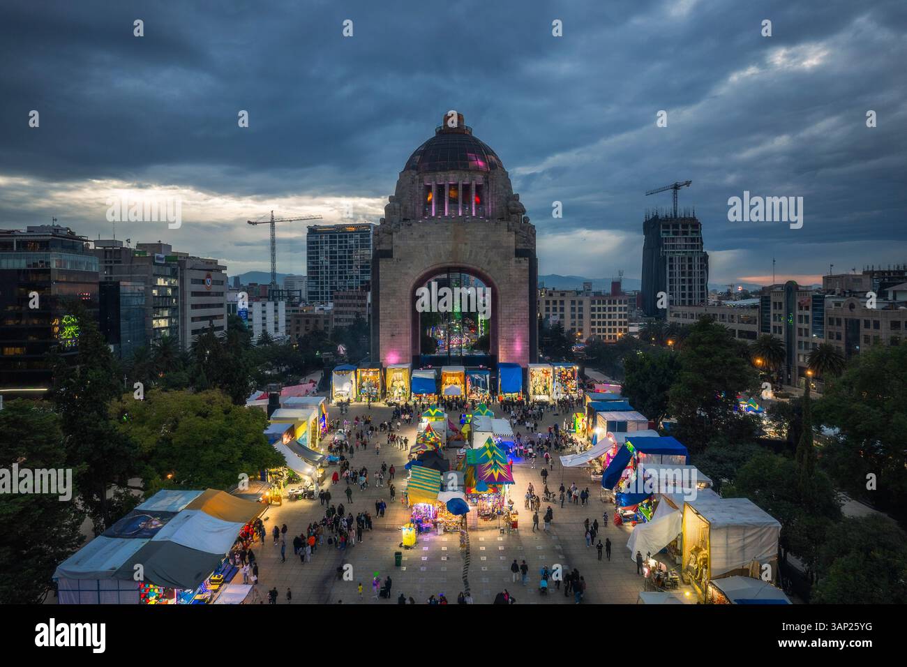 Aerial view of vibrant city fair with colorful ferris wheel and ...