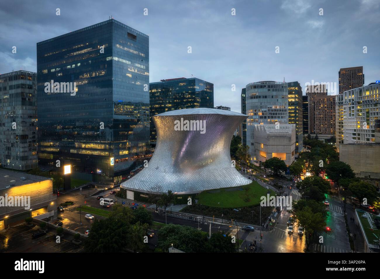 Aerial view of soumaya museum and modern skyscrapers with city lights ...
