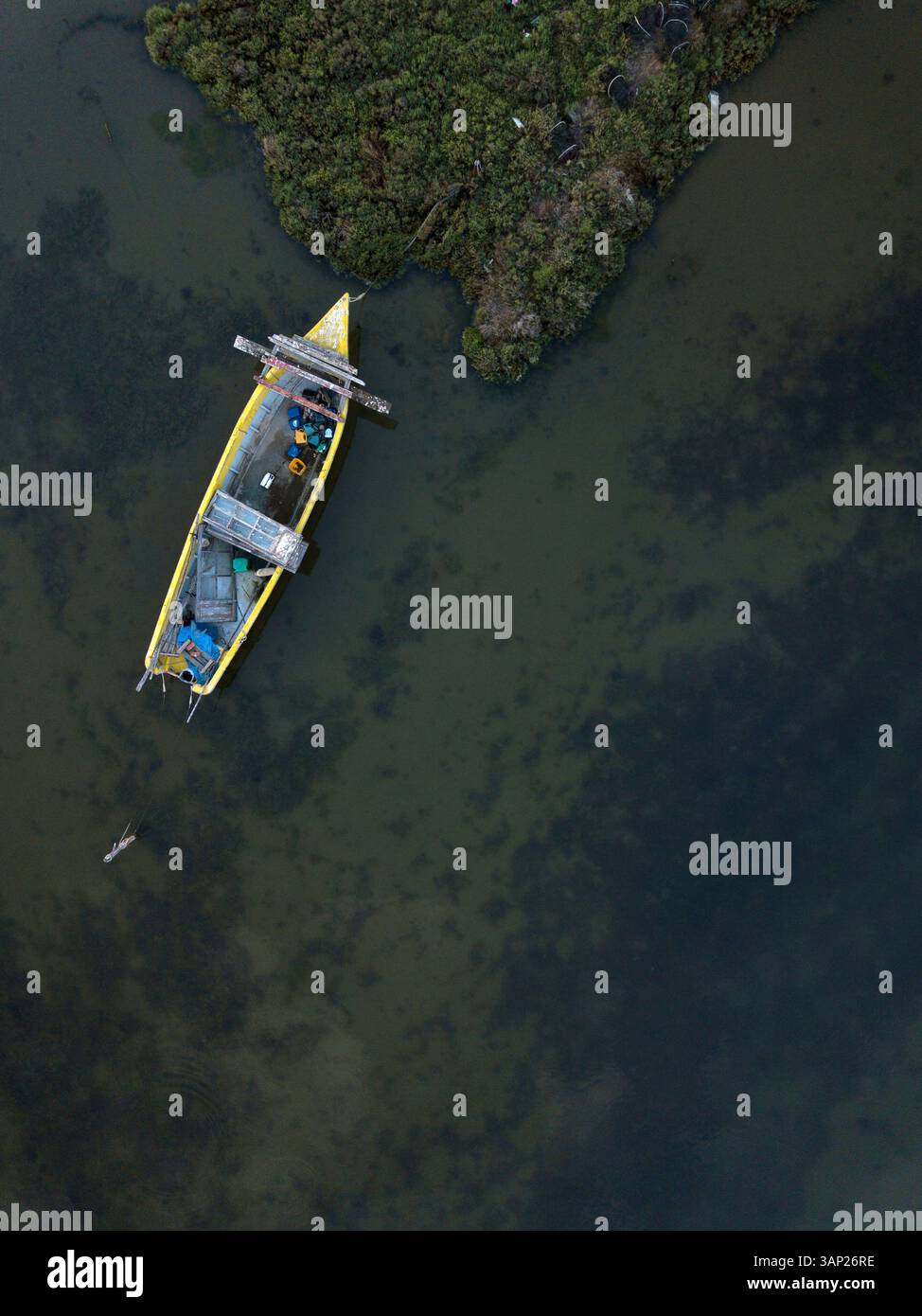 Aerial view of clear Kalochori Lagoon with fishing boat, Kalochori ...