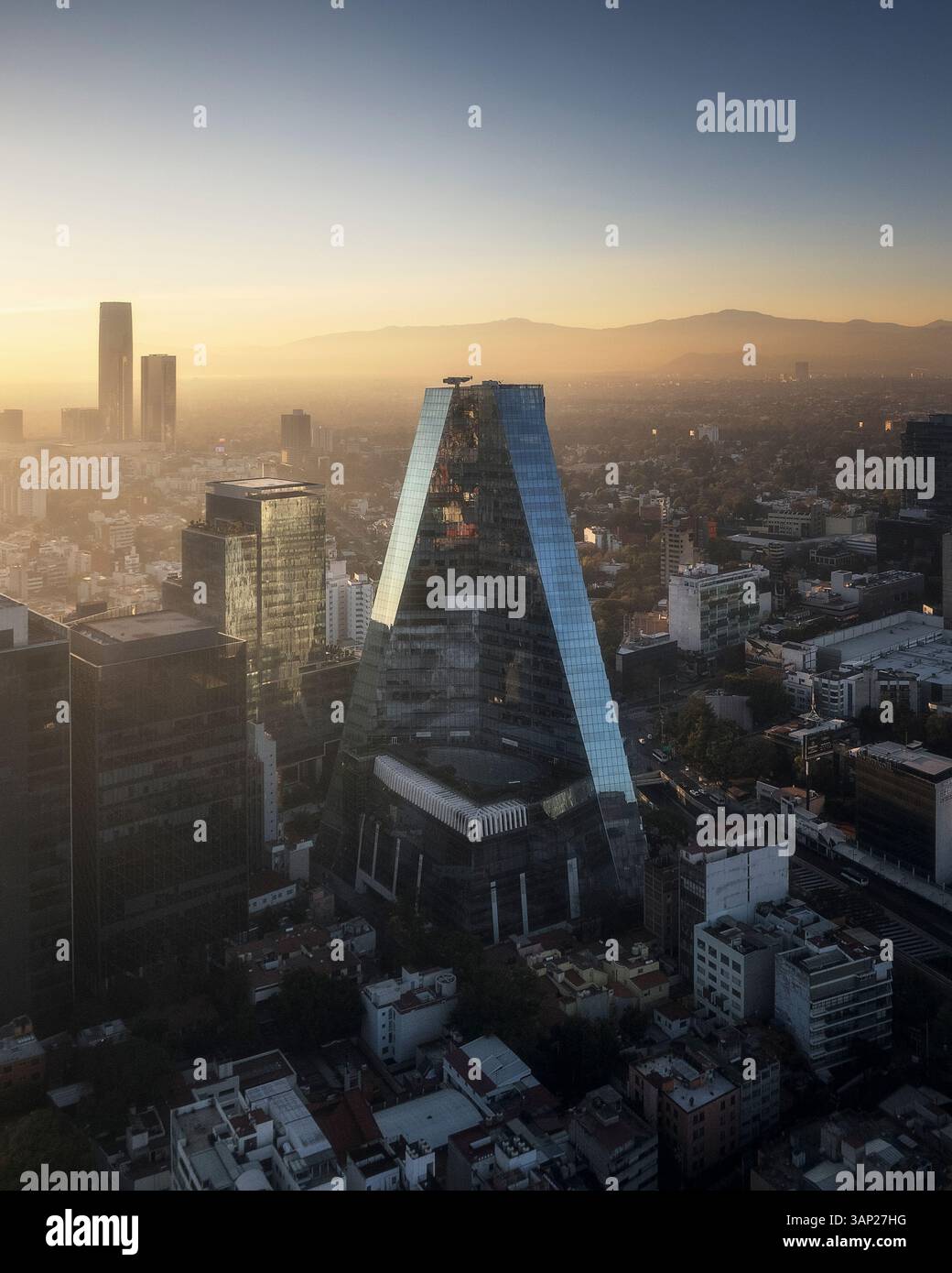 Aerial drone view of Manacar building and city skyline in Mexico City ...