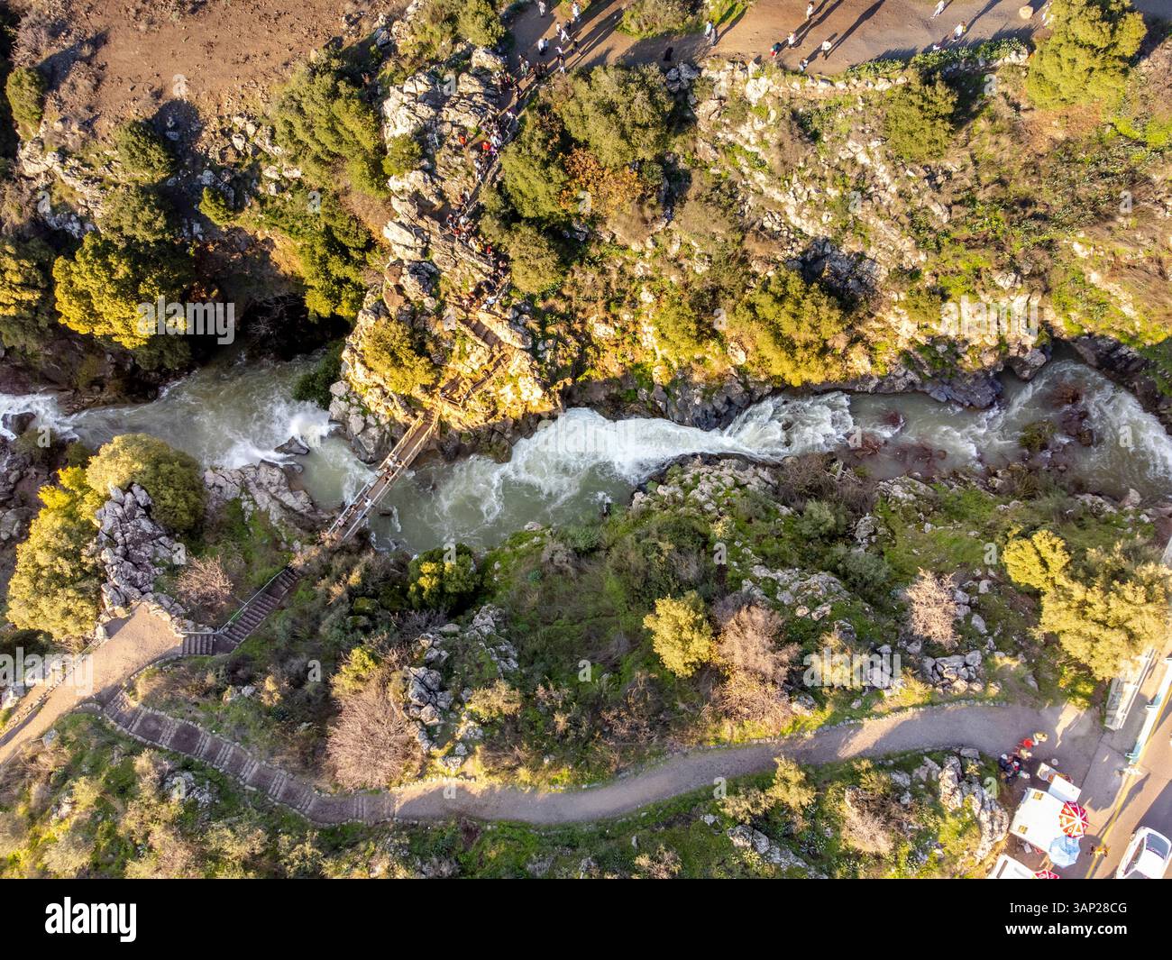 Aerial view of a waterfall in thicket landscape, Golan Heights, Israel ...