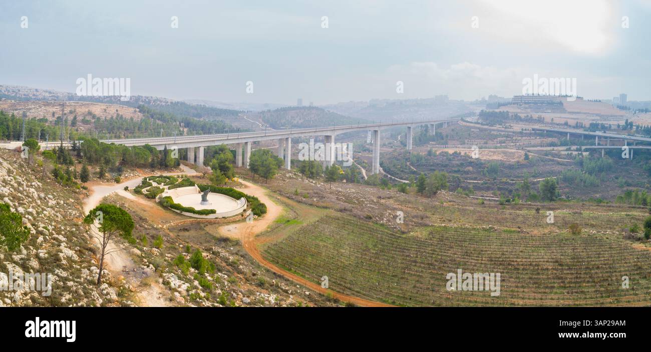 Aerial view of a concrete train bridge leading to a city, Jerusalem ...