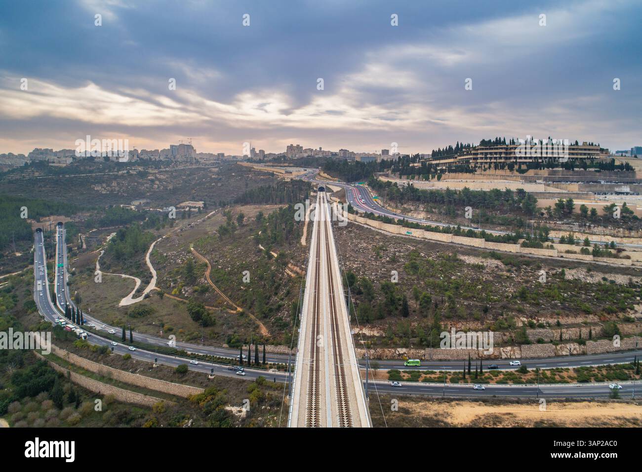 Aerial view of a concrete train bridge leading to a city, Jerusalem ...