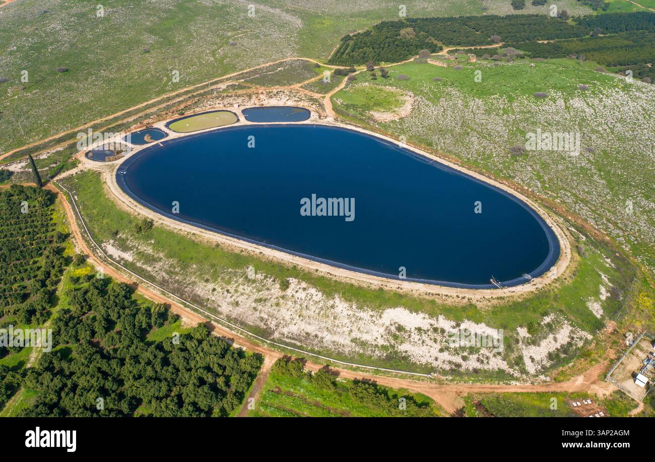 Aerial view of reservoir in a shape of a big foot, Amiad, Northern ...