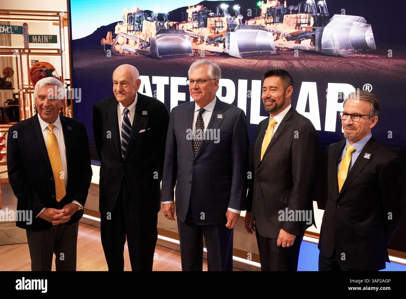 Current, former and incoming Caterpillar CEO's pose for photos on the ...