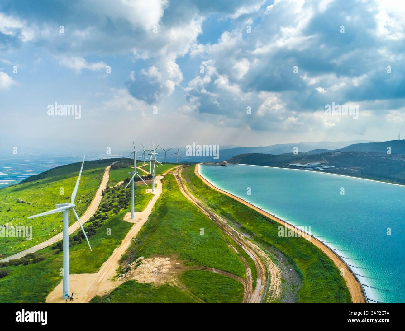 Aerial view of wind turbine and artificial lake, Mount Gilboa, Israel ...
