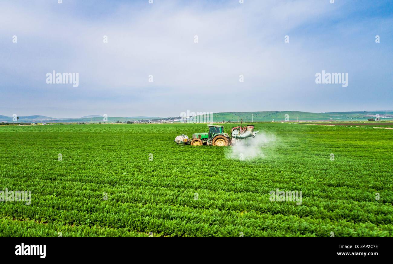 Aerial View of sprinkler at work among the cultivated fields, Beit Alfa ...