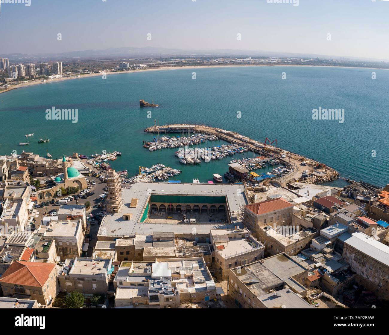 Aerial view of old acre harbor and the Khan of the Pillars building ...