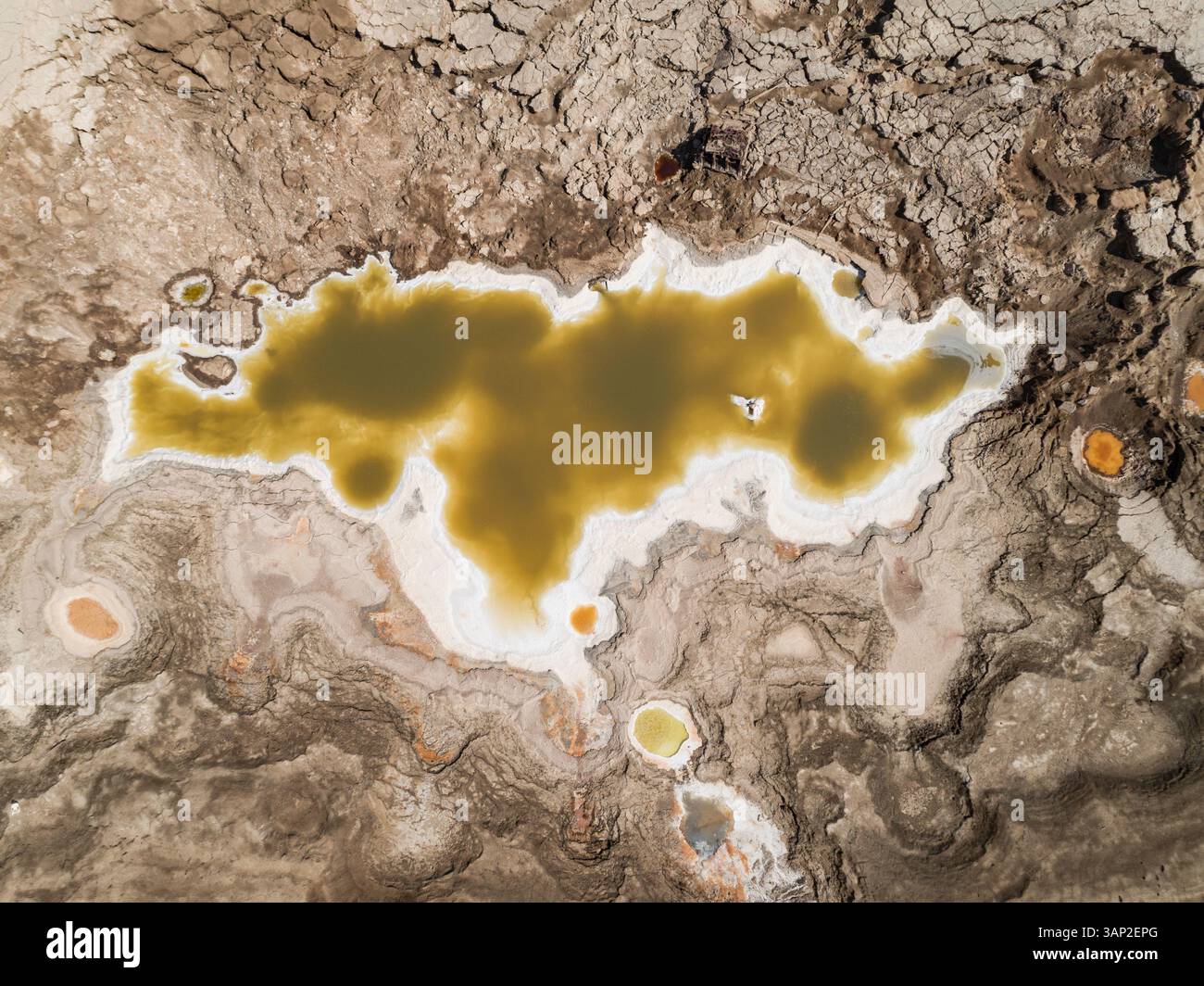 Aerial view of colourful sinkholes along the shoreline of the dead-sea ...