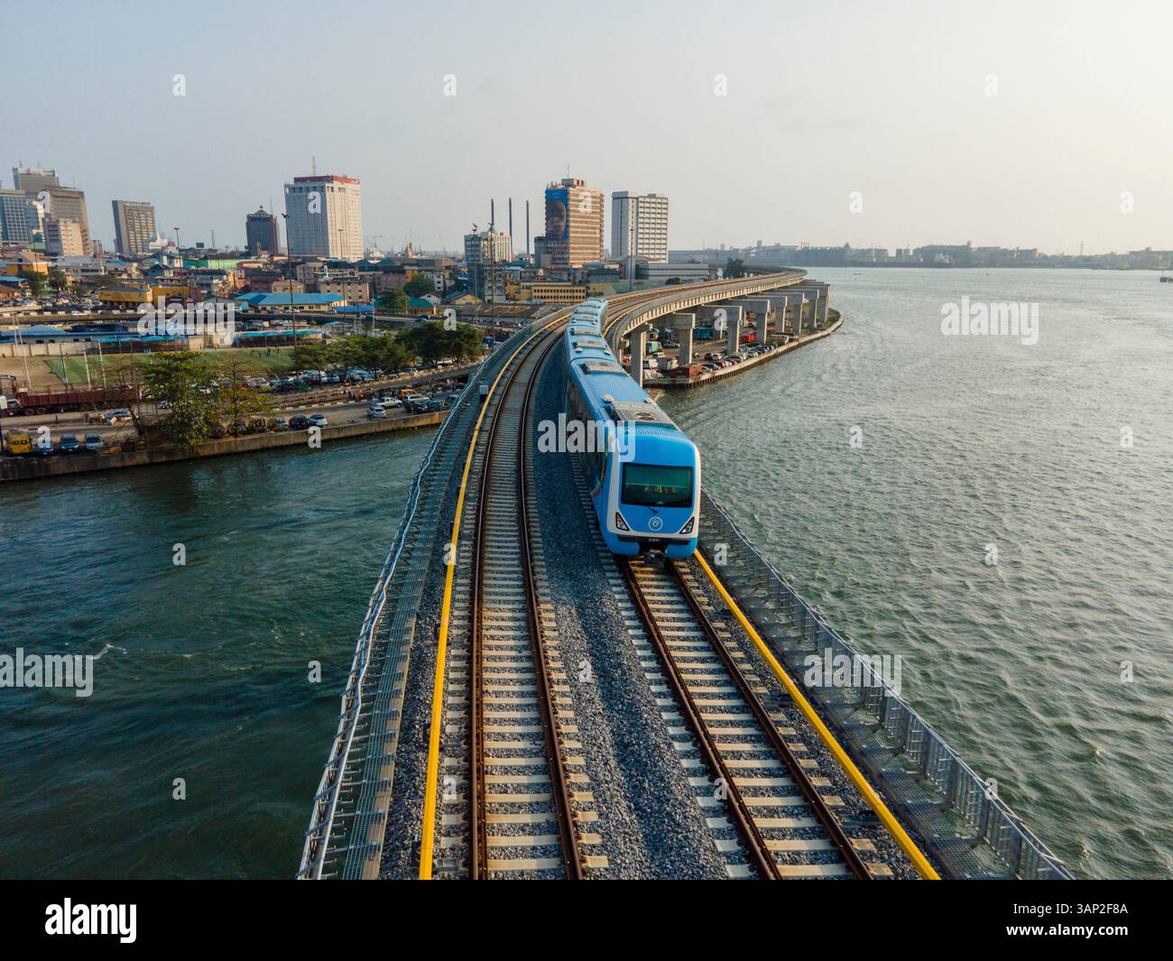 Aerial view of a beautiful urban cityscape with a railway bridge over ...