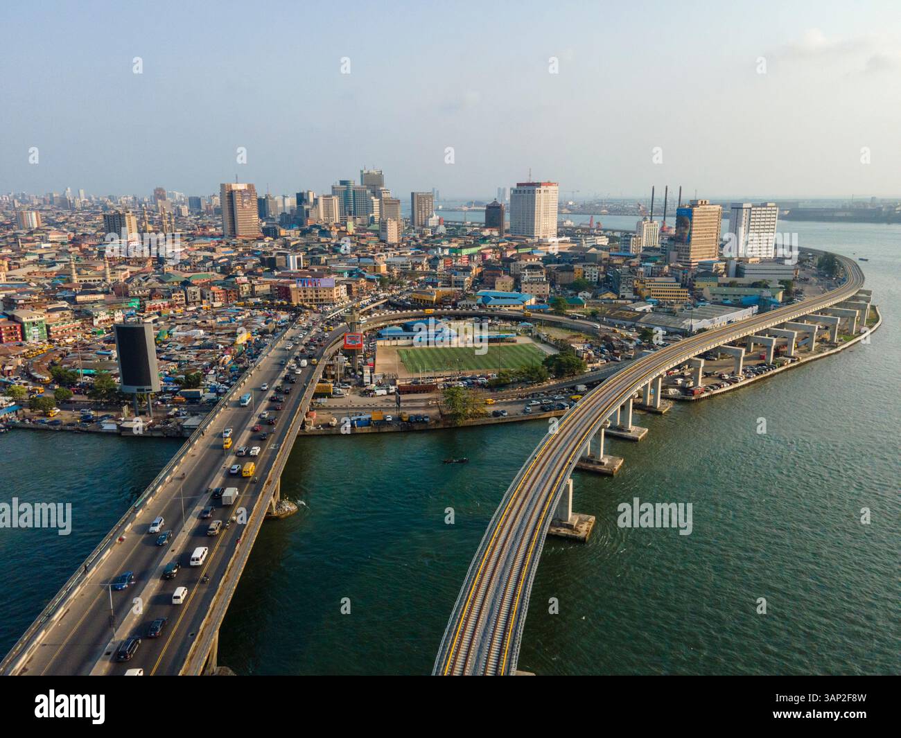 Aerial view of the beautiful skyline with the Lekki Ikoyi Link Bridge over water and urban ...
