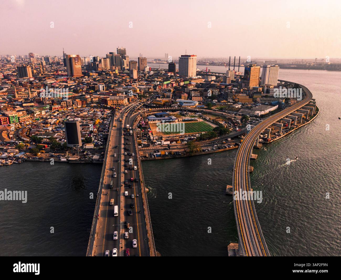Aerial view of the beautiful skyline with the Lekki Ikoyi Link Bridge over water and urban ...