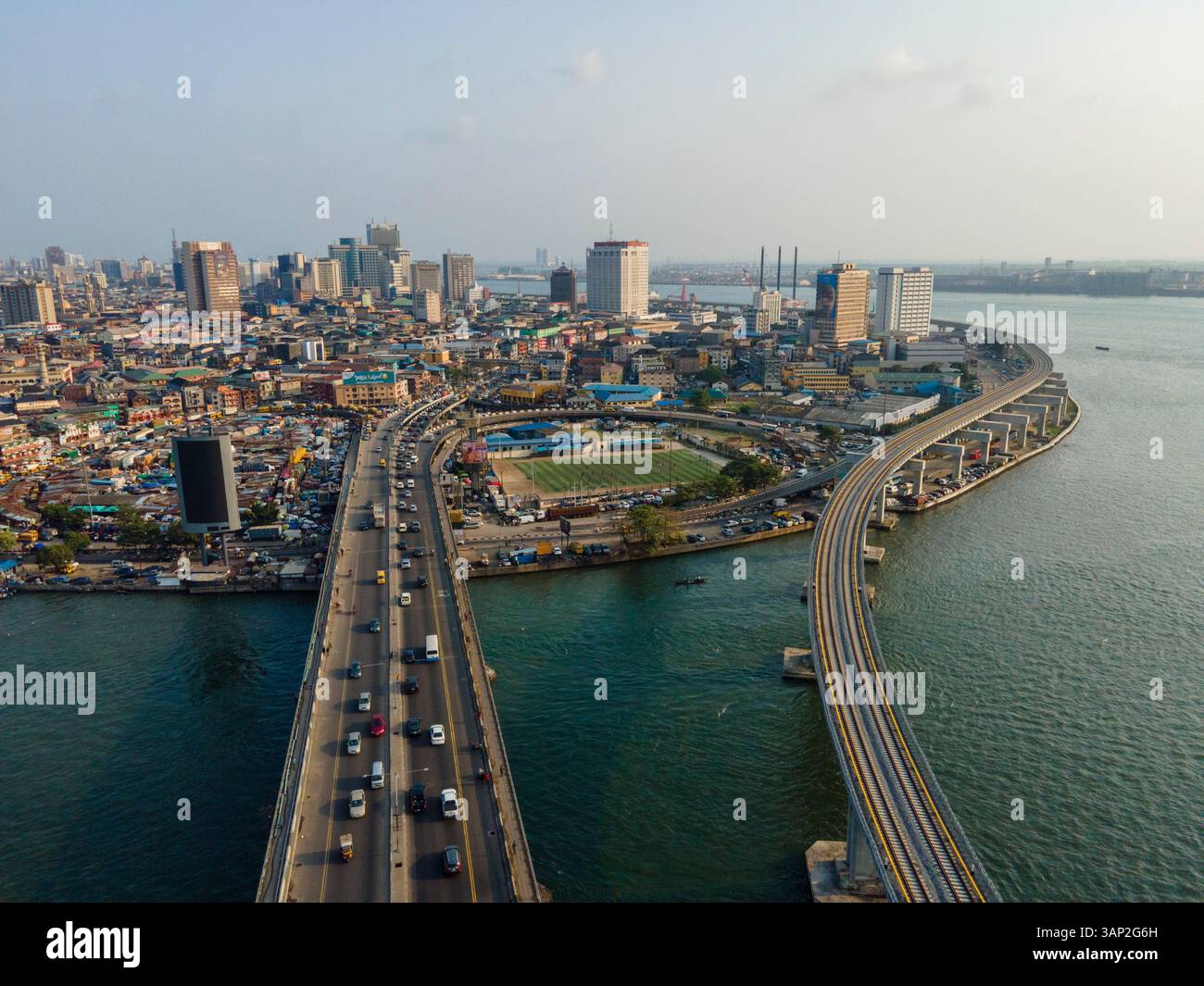 Aerial view of beautiful cityscape featuring the lekki ikoyi link bridge and skyscrapers over ...