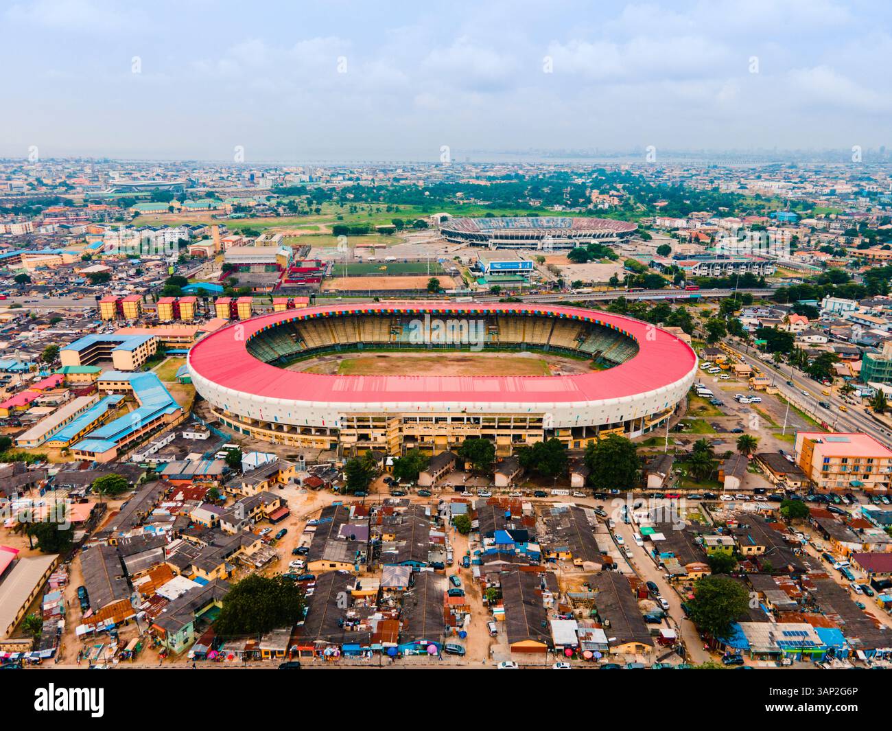 Aerial view of vibrant urban landscape with a stadium and dense ...
