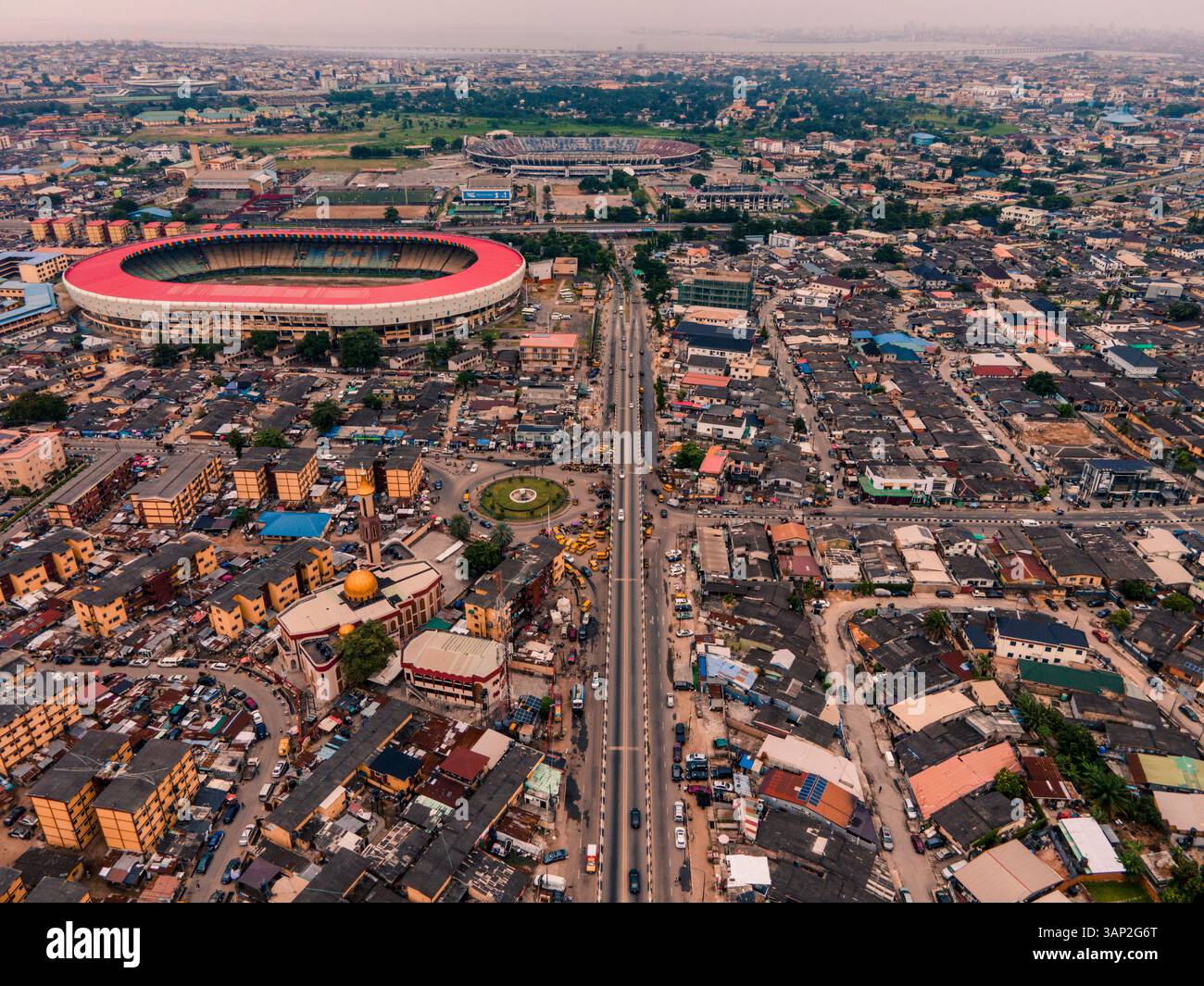 Aerial view of a vibrant and bustling cityscape with high-rise buildings and a stadium, Lagos ...
