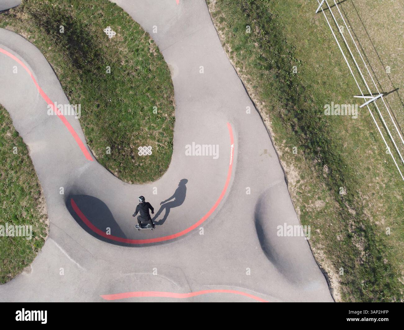 Aerial view of a person with a skateboard in a skate park, Pampigny ...