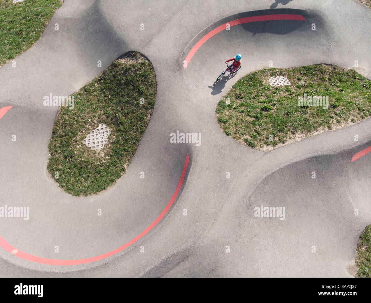 Aerial view of a person with a skateboard in a skate park, Pampigny ...