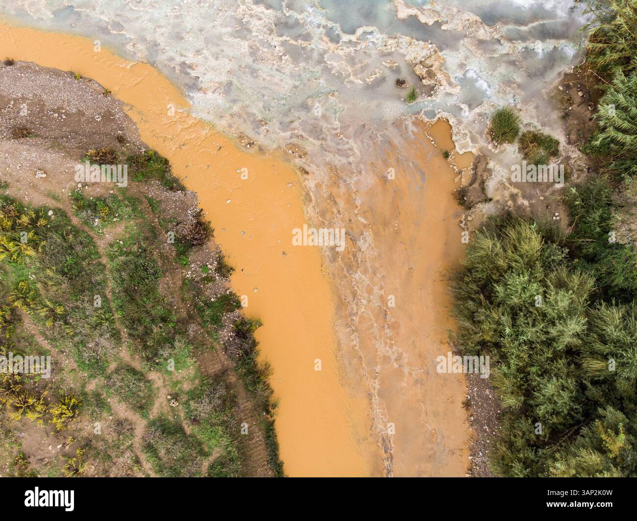 Aerial view of river running off hot springs in Terme Petriolo ...