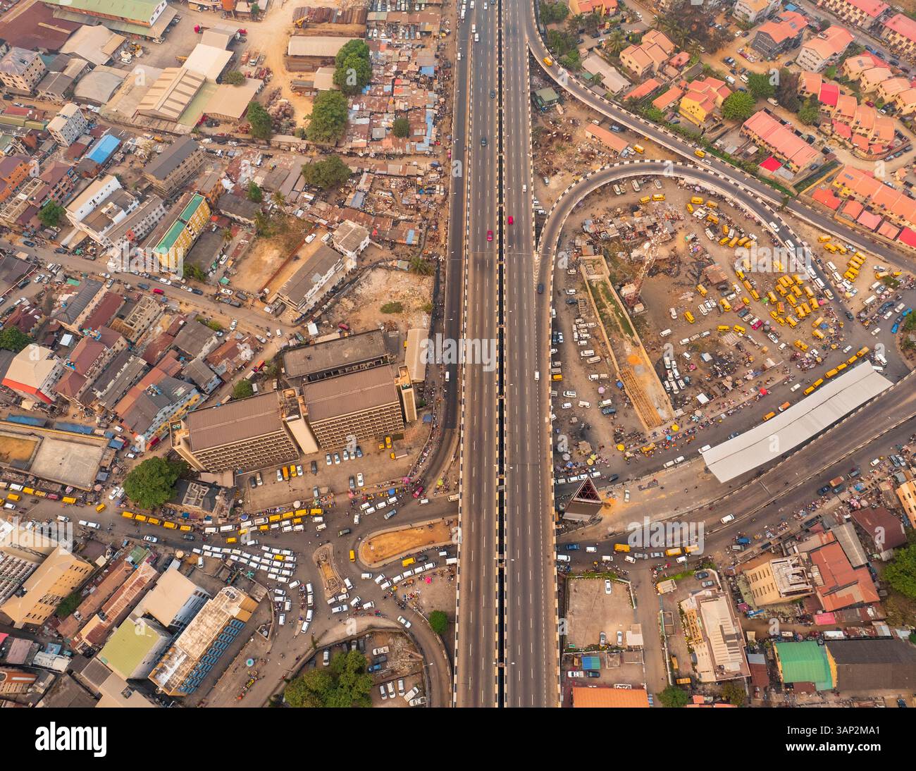 Aerial view of bustling urban intersection with busy traffic and modern buildings, Obalende ...