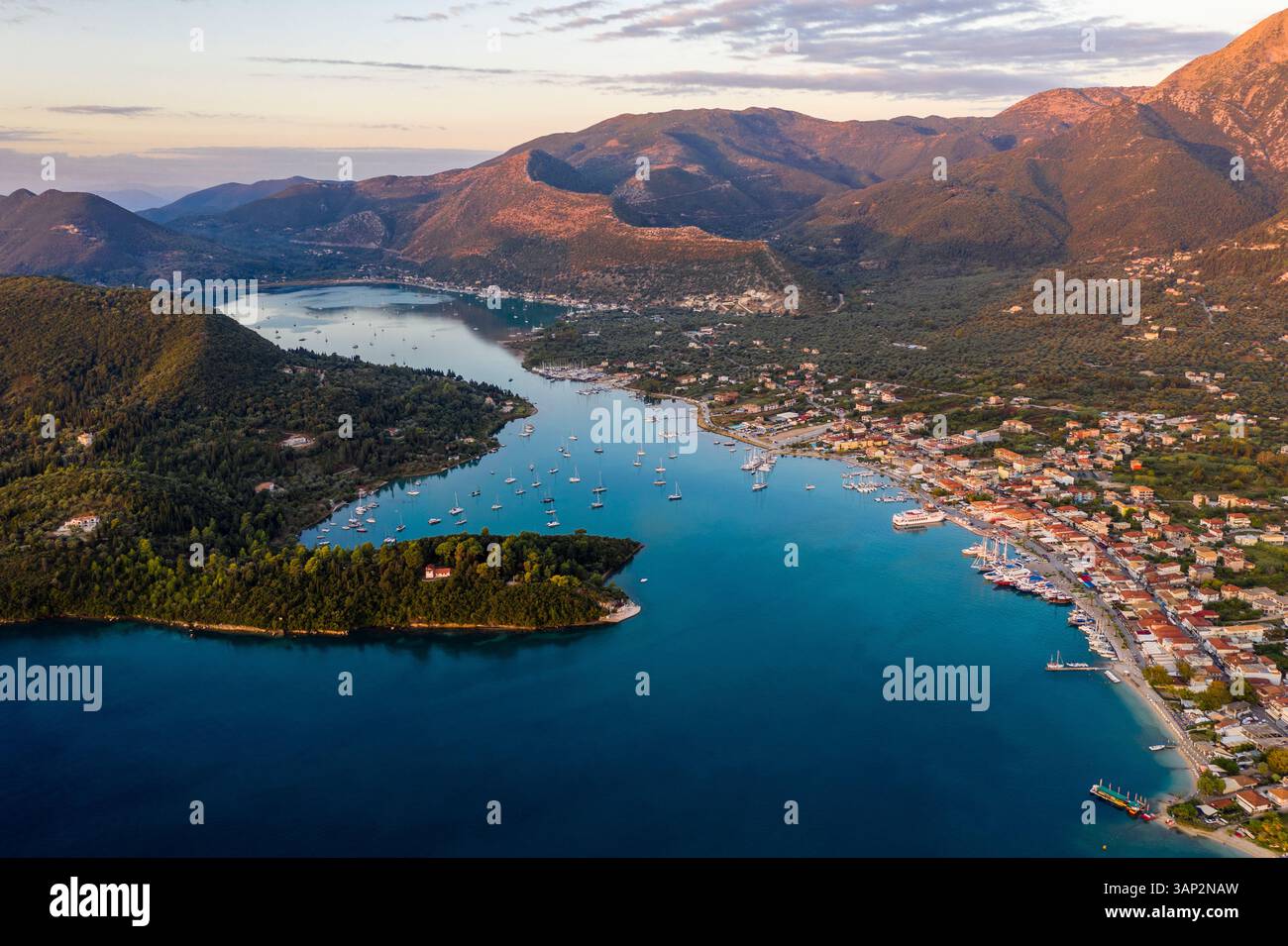 Aerial view of a beautiful island at sunrise with tranquil blue water ...