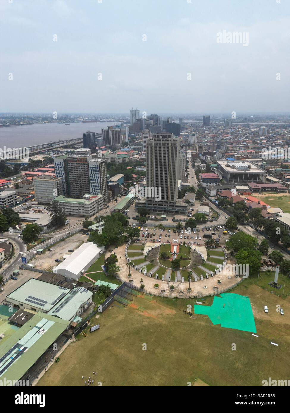 Aerial view of bustling downtown skyline with modern high-rise buildings and a river, Lagos ...