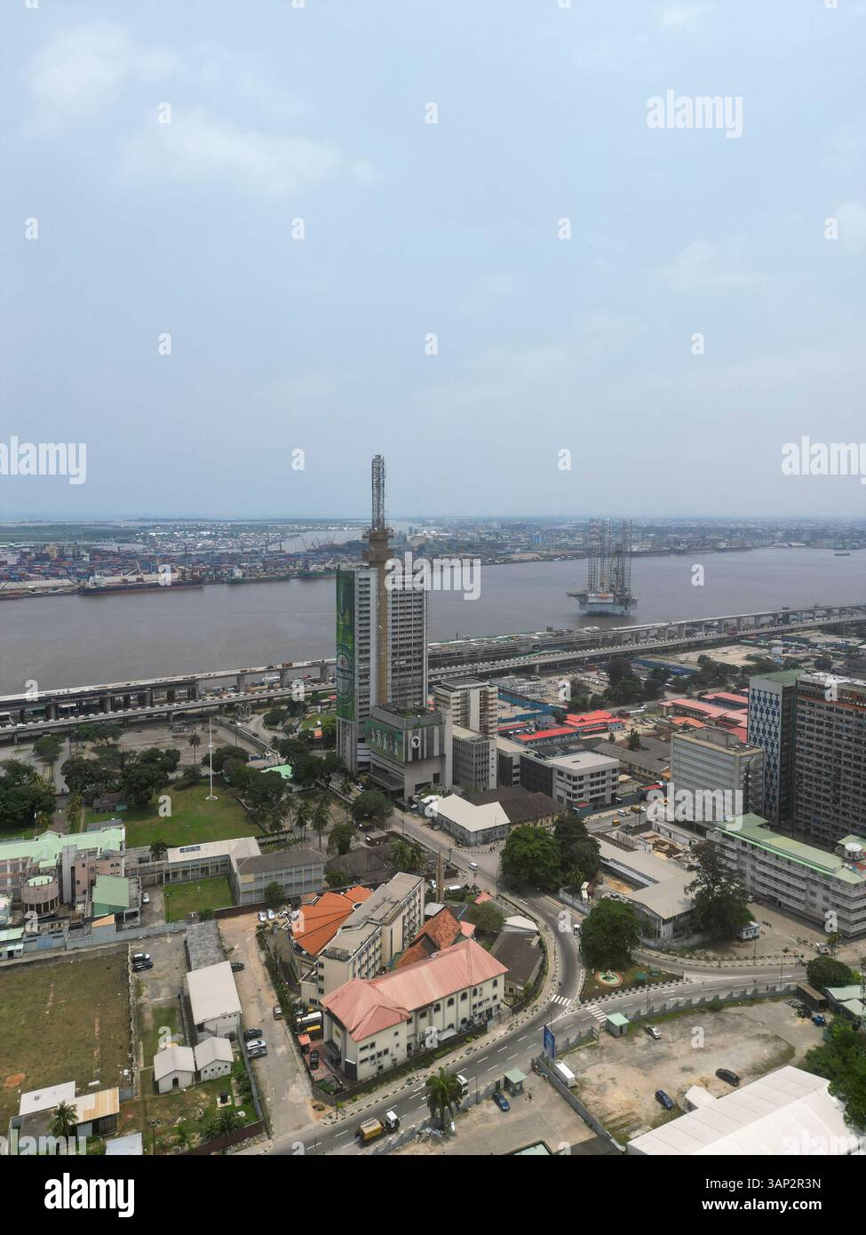 Aerial view of vibrant cityscape with modern high-rise buildings and a river, Lagos, Nigeria ...