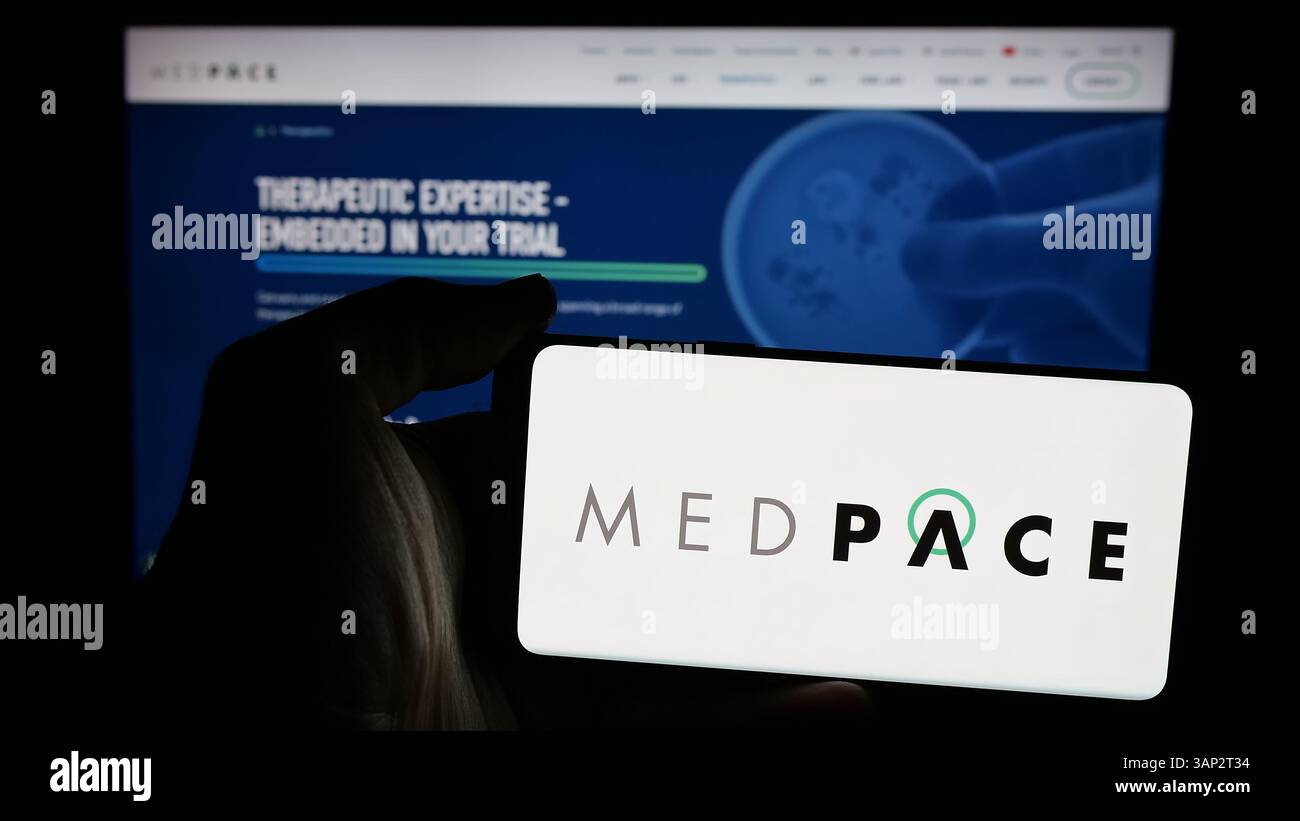 Stuttgart, Germany - 12-05-2024: Person holding mobile phone with logo ...